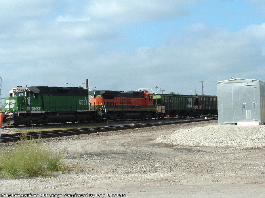 BNSF 6321 heads a mixed freight toward the yard.